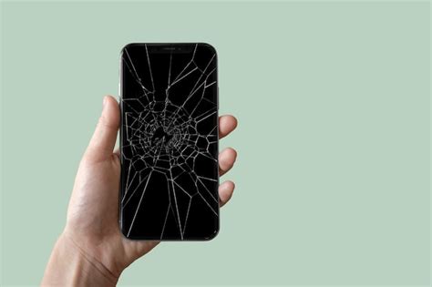 Premium Photo Hand Holding Broken Phone Screen Protector