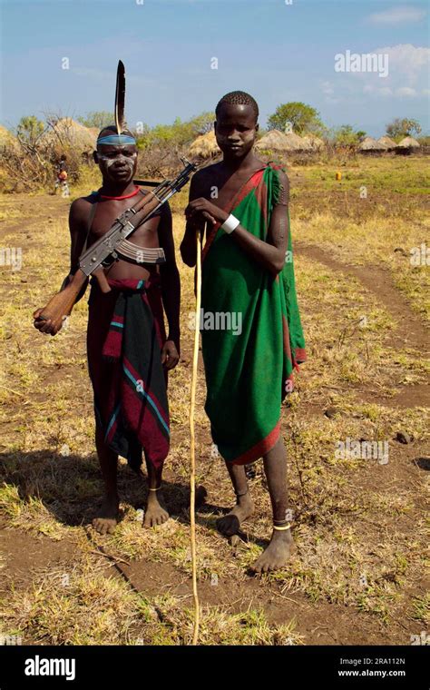 Men With Kalashnikov Mursi Tribe Mago National Park Southern
