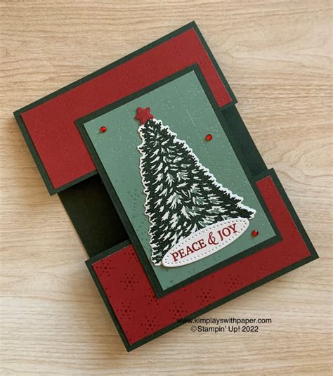 trimming the tree open panel kim plays with paper