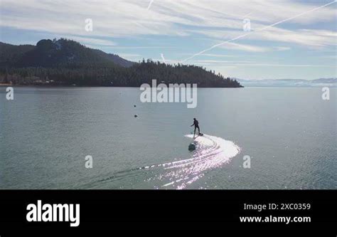 2020 A Man Rides A Hydrofoil Hoverboard Efoil Electronic Surfboard Across Lake Tahoe