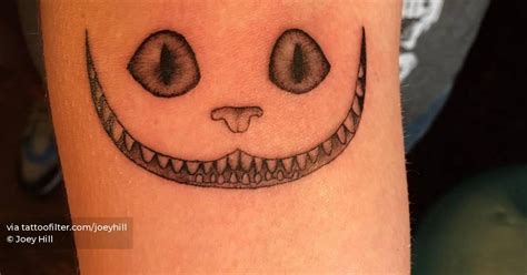 Cheshire Cat Tattoo Located On The Inner Forearm