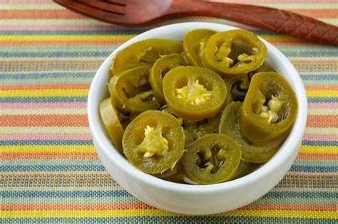 Premium Photo Bowl With Sliced Pickled Green Jalapeno Peppers Close Up