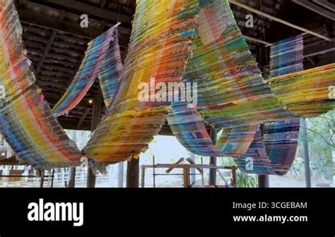 Vibrant Fabric Weaving Under A Wooden Structure Stock Video Footage Alamy