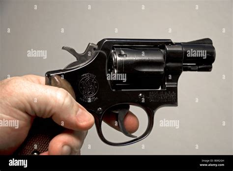 Finger On The Trigger Of A Smith And Wesson 38 Caliber Snub Nose