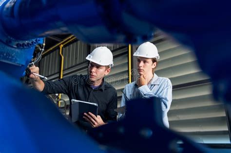 Engineer Inspection Control A Robot Arm Welding Machine With A Remote System In An Industrial