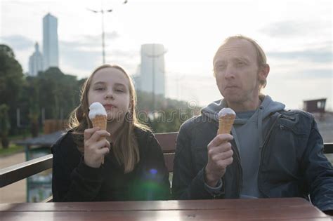 Portrait of Cute Child and Father Eating Ice Cream in Cone. Happy Vacation and Holiday Concept ...