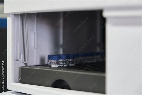 Vials With Sample Into Autosampler Of HPLC System Ready To Be Analyzed High Performance Liquid
