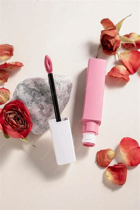 Premium Photo Pink Liquid Lipstick And Applicator Brush With Flowers