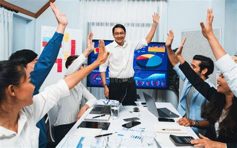 Analyst Team Leader Celebrate With Colleague After Successful Meeting