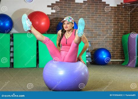 Fitness Training Young Beautiful White Girl In A Pink Sports Suit Does
