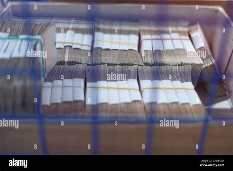 Bank Employees Sorting And Counting Money Inside Bank Vault Stock Photo