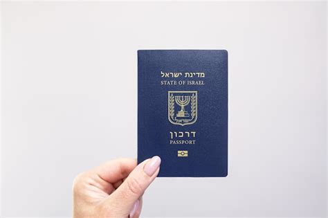 Premium Photo Passport Israel Held Against Simple White Background