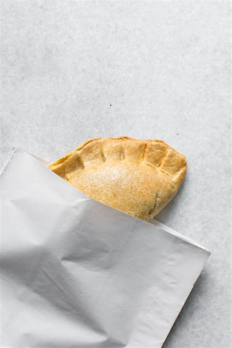 Nigerian Meat Pie In White Bakery Bag Freshly Baked Nigerian Meat Pie In Bakery Packaging Stock