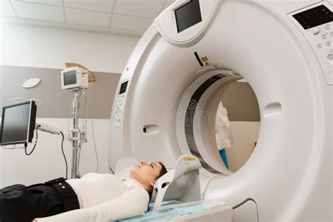 Girl Patient Is Doing Computed Tomography X Ray Examination Of Tumor In