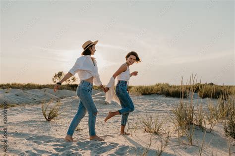 Happy Two Young Women Having Fun On The Sunset Beach Queer Non Binary