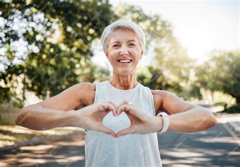 Premium Photo Fitness Happy And Heart Hands Of Old Woman In Nature