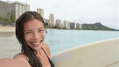 Surfing Surfer Girl Taking Selfie Photograph Holding Surfboard On Beach