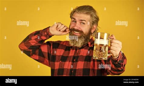 German Man With Beer Enjoying Glass At Pub Anticipating Fresh Cold