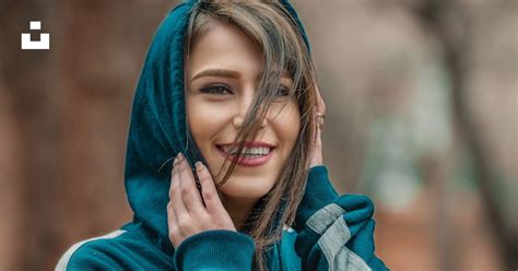 Smiling Woman Wearing Blue Hoodie In Selective Focus Photography Photo