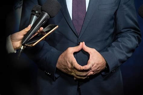 Premium Photo Midsection Of Politician Giving Interview
