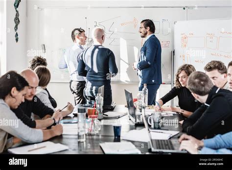 Relaxed Informal It Business Startup Company Meeting Team Leaders Discussing And Brainstorming