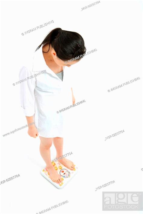 Woman On Weighing Scales Stock Photo Picture And Royalty Free Image Pic NGR E