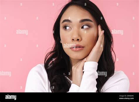 Image Of Young Brunette Asian Woman In Casual Clothes Looking Aside At
