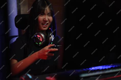 Premium Photo Female Cyber Hacker Gamer Using Controller Joystick To