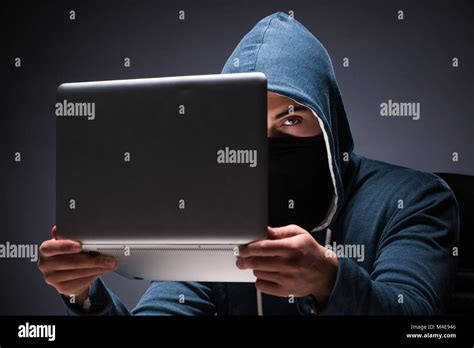 Computer Hacker Working In Dark Room Stock Photo Alamy