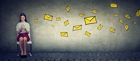 Young Woman Sending Multiple Emails And Messages On Her Mobile Phone