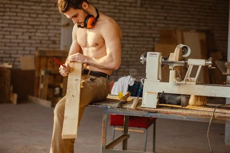 Carpenter Using Straightedge To Draw Line On Board Stock Photo Image