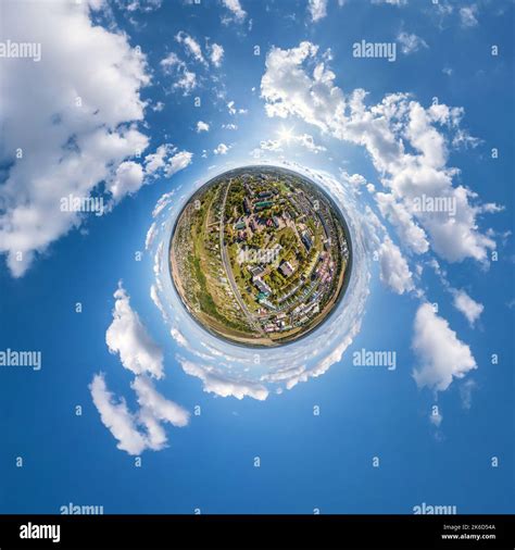 Tiny Planet In Sky With Clouds Overlooking Old Town Urban Development