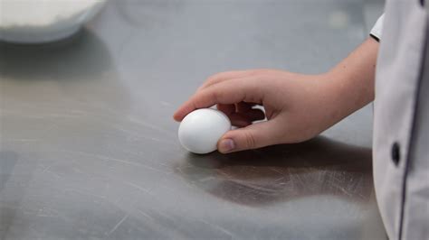 Female Hands Holding A Cracked Egg Breaking An Egg Slow Motion