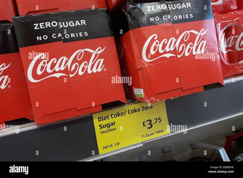 Cans Of Coca Cola Diet Coke And Coke Zero Are Pictured On A Shelf In
