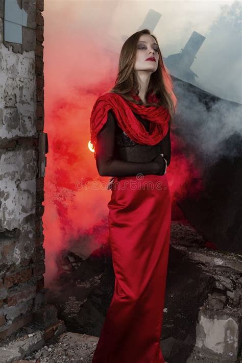 Beautiful Fashion Model Girl Wearing A Red Long Skirt And A Red Stock