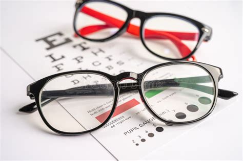 Glasses On Eye Testing Exam Chart To Check Eyesight Accuracy Of Reading