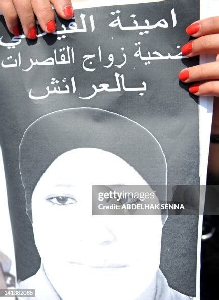 A Woman Holds A Poster Of Amina Al Filali Reading Amina Al Filali News Photo Getty Images