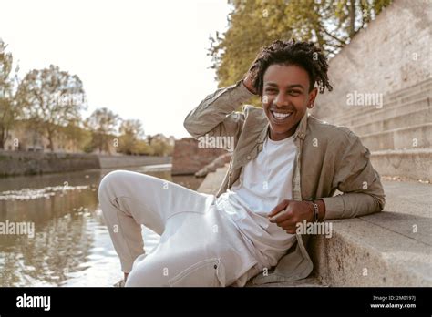 Happy Man Dark Skinned Guy Smiling Confidently At Camera Resting