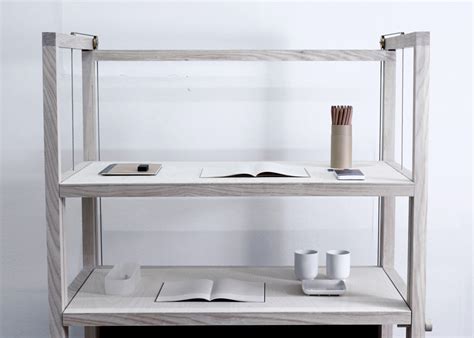 A Shelf Of Tables Is Three Desks In One Shelf
