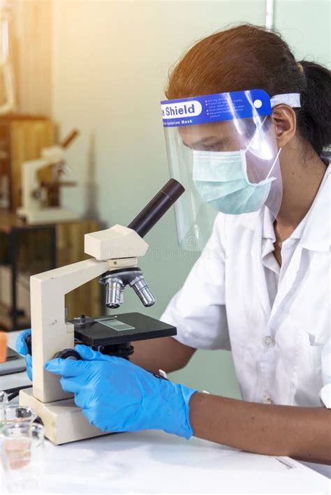 Indian Scientist Man Look Into Microscope Research In Science