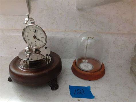 Small Rotary Pendulum Clock And Watch Stand Delaware Auction Center