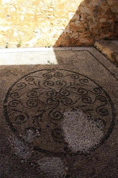 a stone floor with a circular design on it