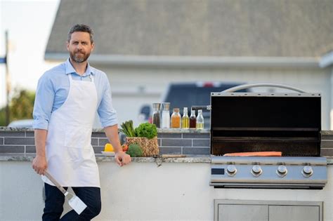 Premium Photo Man Grilling Salmon Fillet At Backyard Copy Space Photo