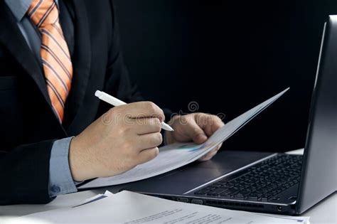 Businessman Using Laptop Computer With Alerts Warning Triangles