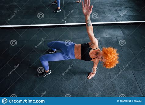 Top View Sporty Redhead Girl Have Fitness Day In Gym At Daytime Stock
