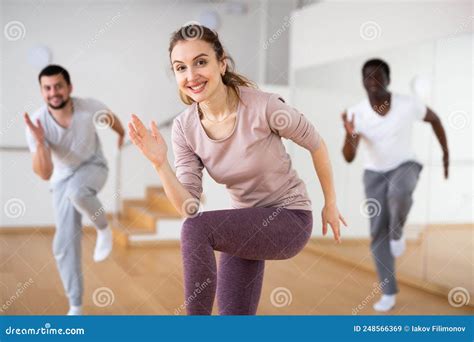 Woman Dancing Aerobic Dance With Men In Studio Stock Image Image Of