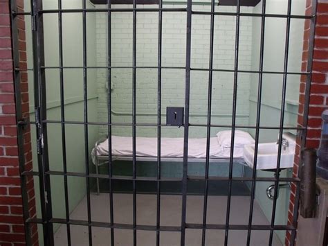 Download A Prison Cell With A Bed