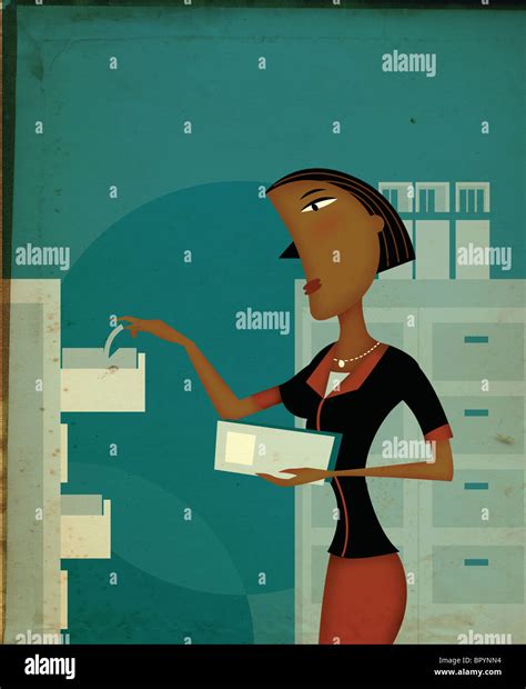 A Woman Filing Documents Into A Cabinet High Resolution Stock