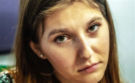 Portrait Of Smiling Young Girl Without Makeup With Long Brown Hair
