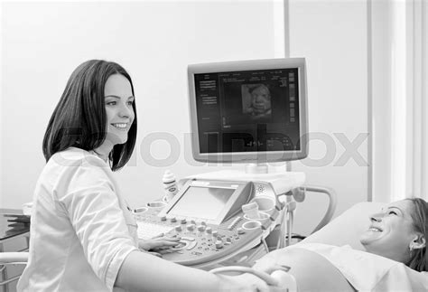 Pregnant Woman Having Ultrasonic Scanning At The Clinic Stock Image